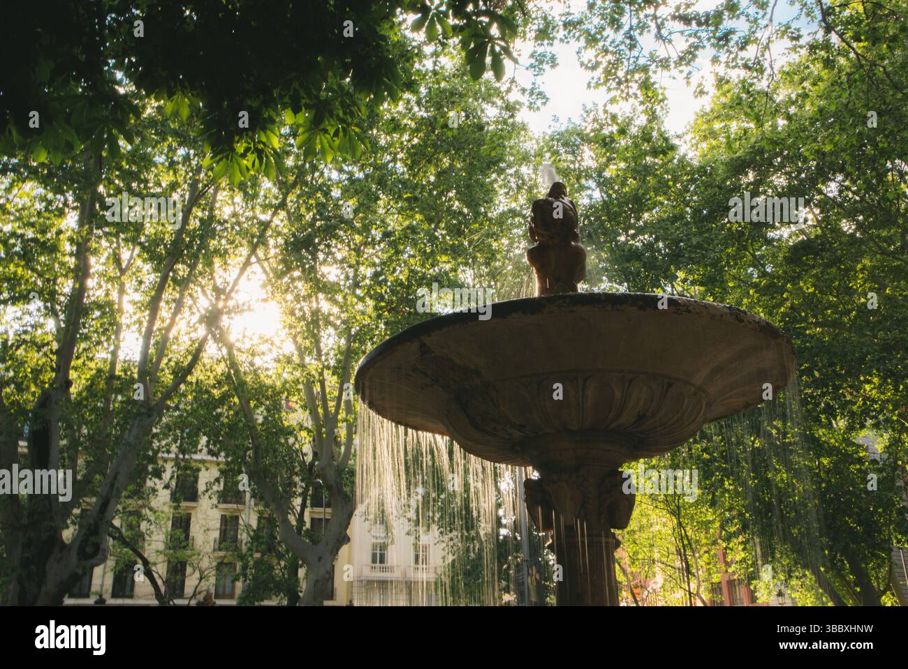 Madrid Spain 4 May 2024 A beautifully stone fountain amidst lush ...