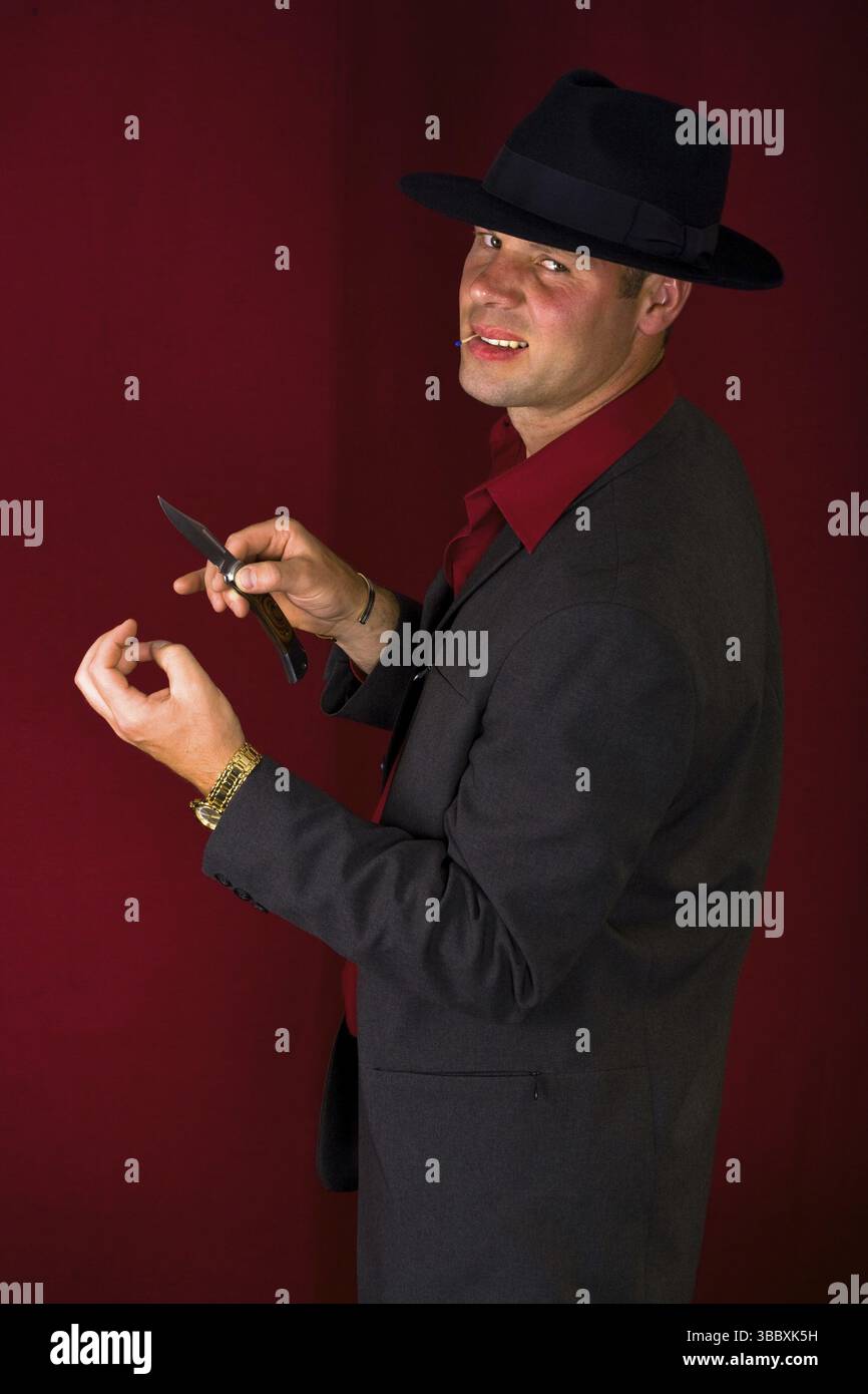 Crime scene of mafia extortion. Two mobster with a gun Stock Photo - Alamy