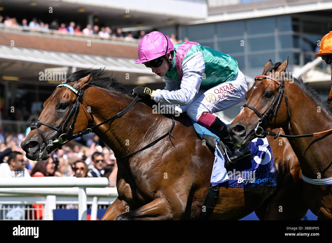 Newbury, UK. 17th May, 2025. Lead Artist ridden by Oisin Murphy (pink ...