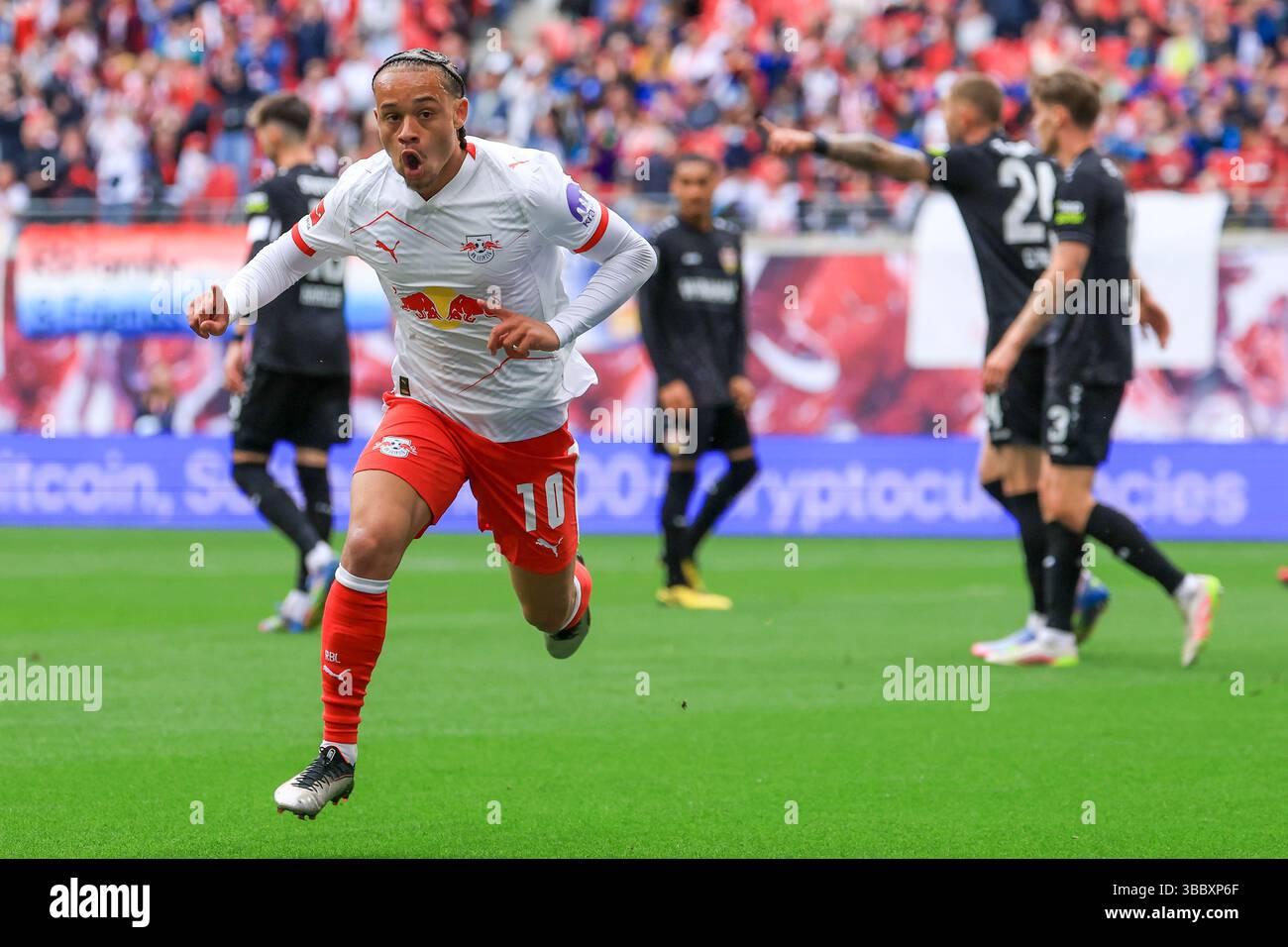 Leipzig's Xavi Simons celebrates after scoring during the German ...