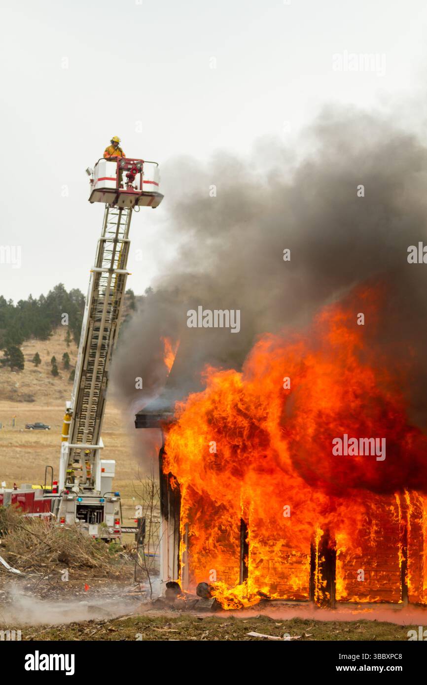 aerial ladder truck over a fire Stock Photo - Alamy