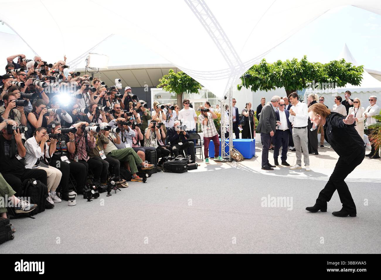 Bono poses for photographers at the photo call for the film 'Bono ...