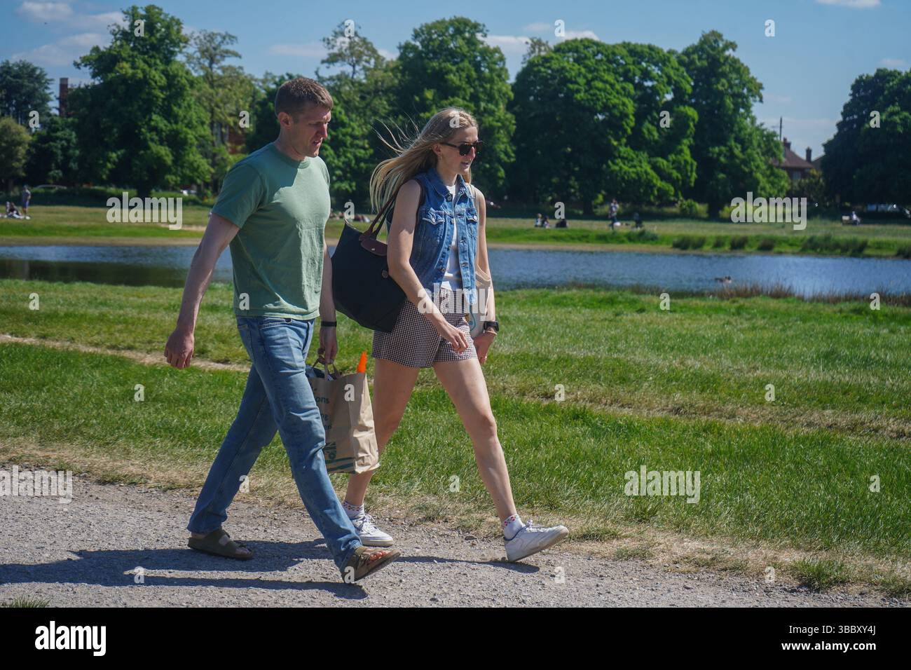 London, UK. 17 May 2025. People relaxing in the afternoon sunshine on ...