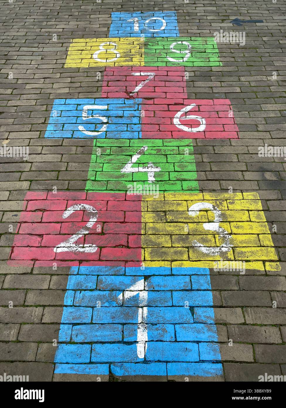 Hopscotch on brick pavement, colorful squares, numbers 1-10, outdoor ...