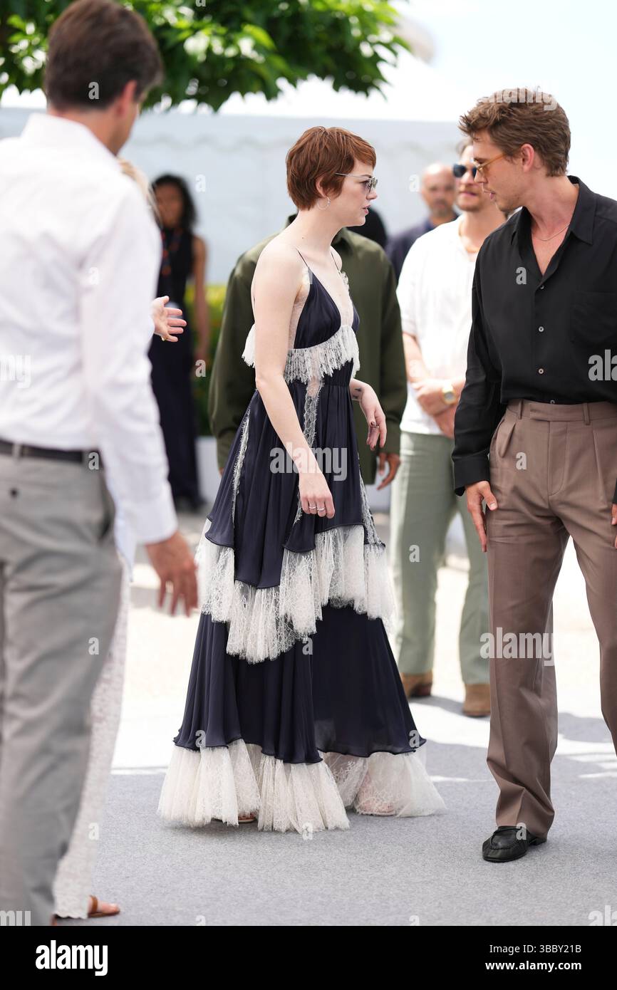 Emma Stone, center, and Austin Butler, right, pose for photographers at ...