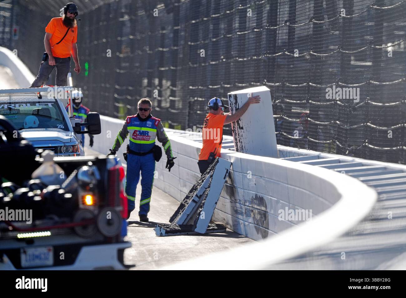 INDIANAPOLIS, IN - MAY 17: IndyCar safety workers repair the safety ...