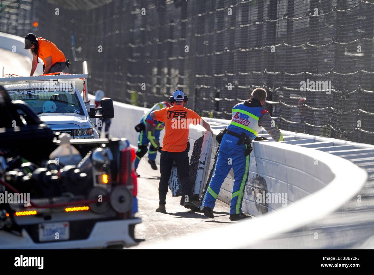 INDIANAPOLIS, IN - MAY 17: IndyCar safety workers repair the safety ...