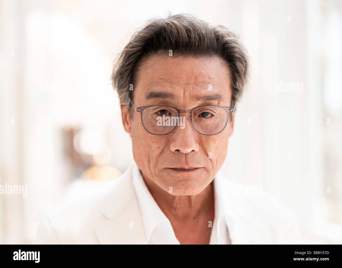 Tony Leung Ka-fai poses for portrait photographs for the film 'Sons of ...