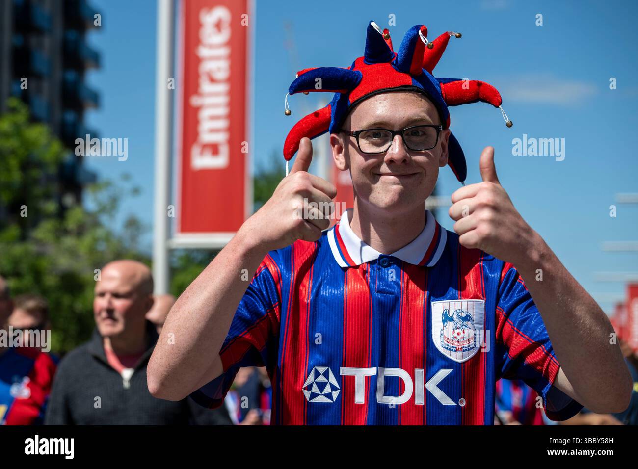 London, UK. 17 May 2025. A Crystal Palace fan in Olympic Way outside ...