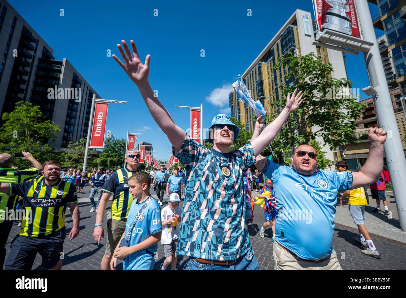London, UK. 17 May 2025. Manchester City fans arrive in Olympic Way ...