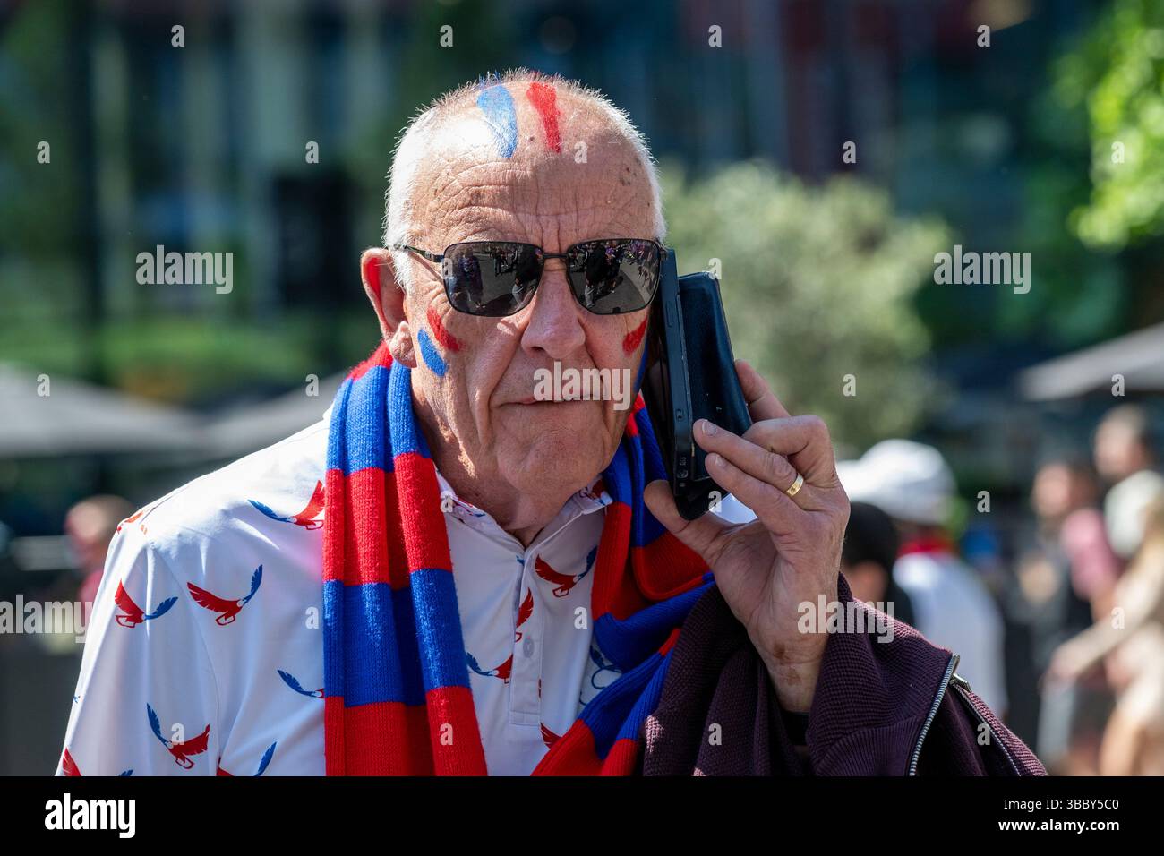 London, UK. 17 May 2025. A Crystal Palace fan in Olympic Way outside ...