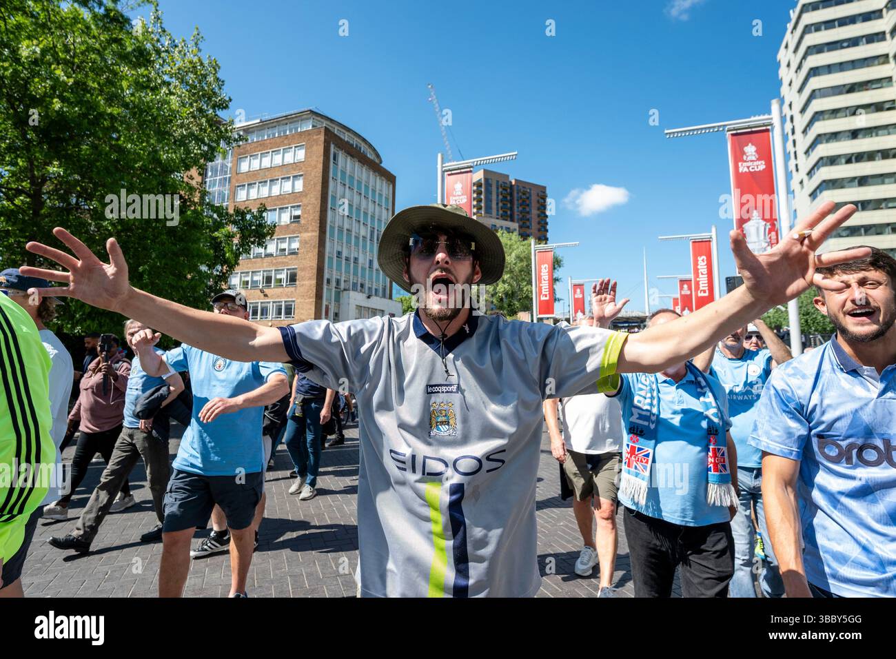 London, UK. 17 May 2025. Manchester City fans in Olympic Way outside ...