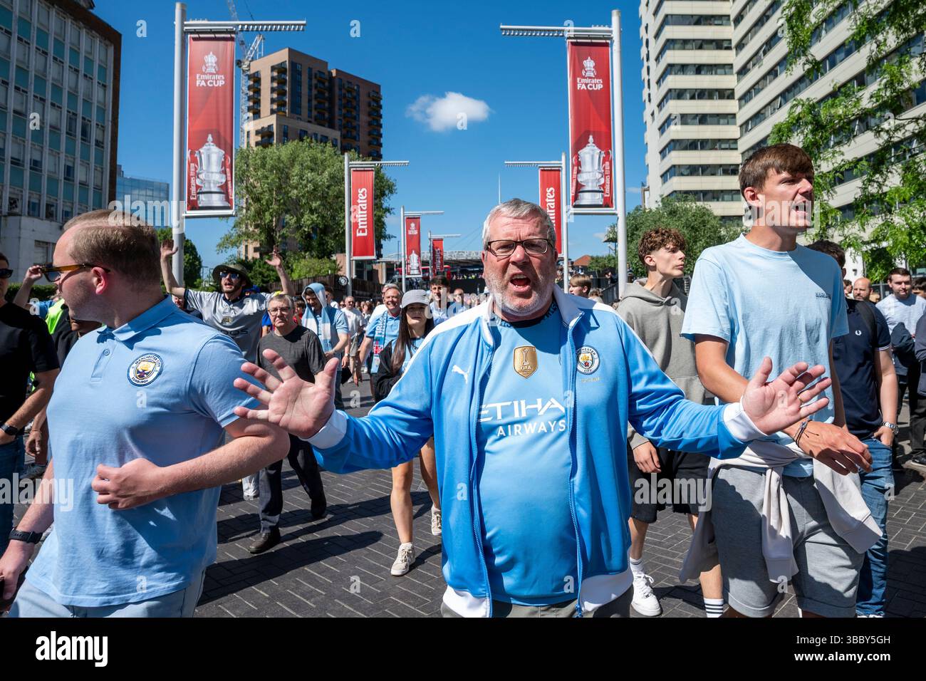 London, UK. 17 May 2025. Manchester City fans in Olympic Way outside ...