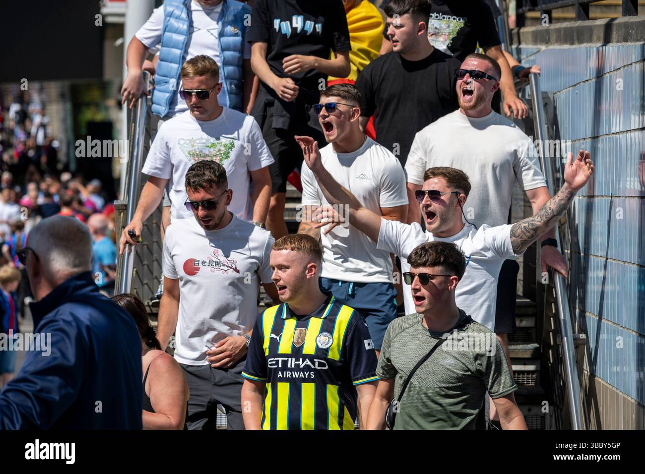 London, UK. 17 May 2025. Manchester City fans in Olympic Way outside ...