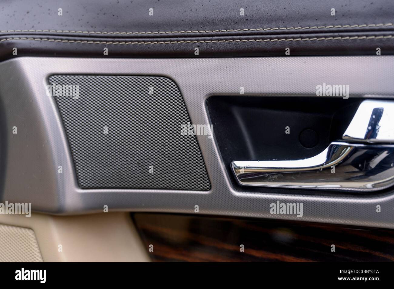 Close-up of control buttons on the door of a modern car. Door of a ...