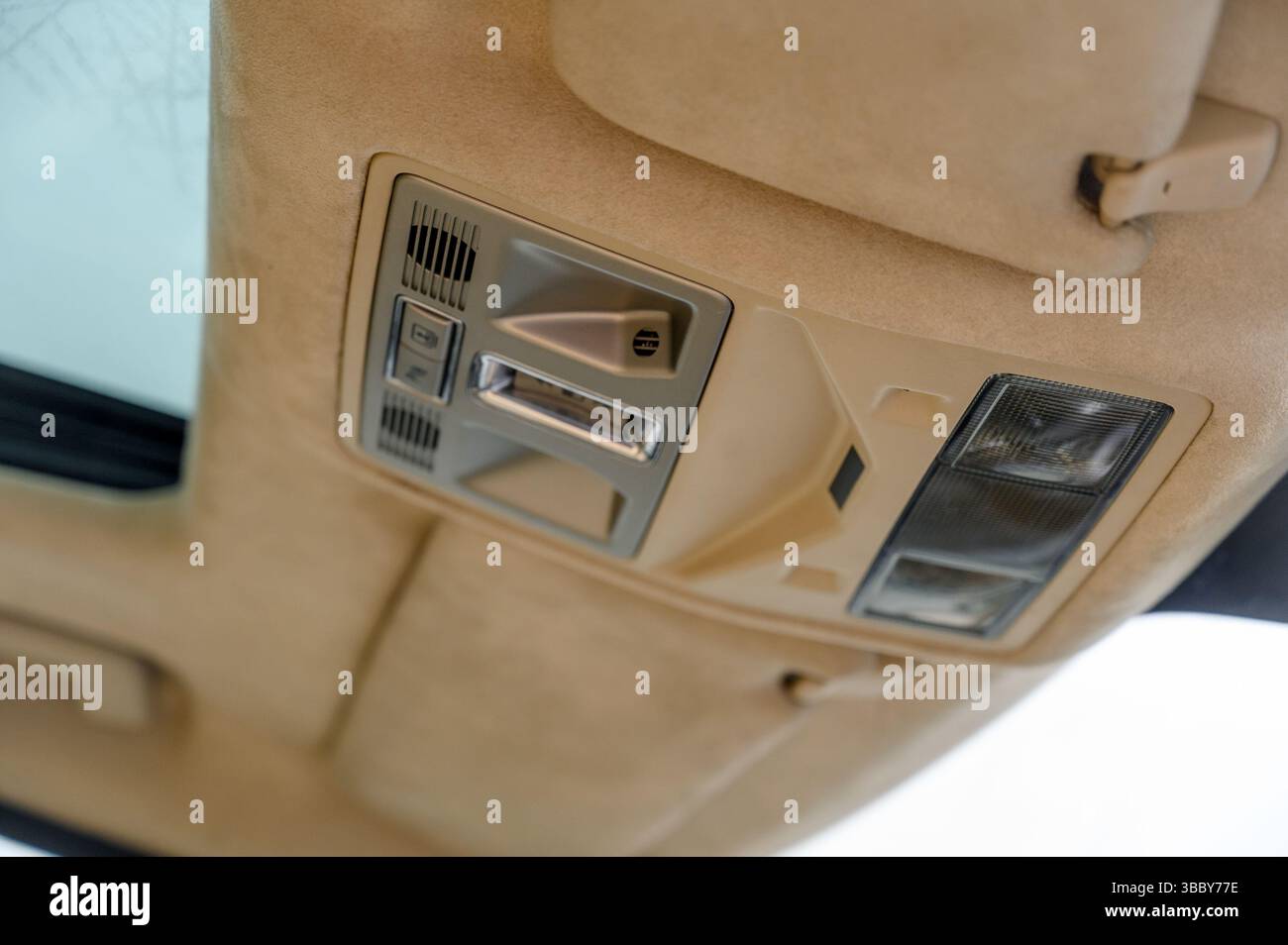 Closeup image of a vehicles overhead control panel showing passenger ...