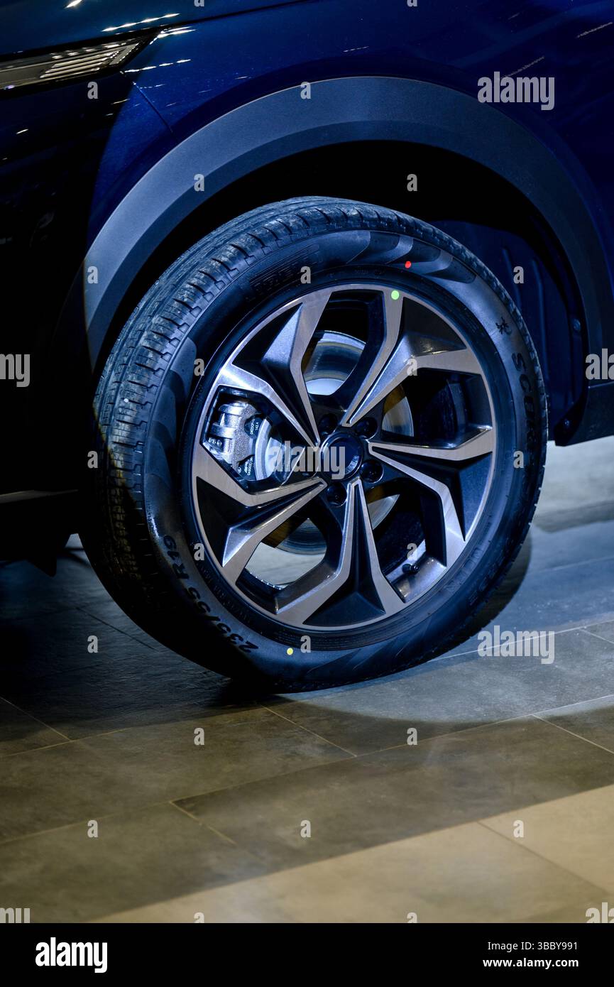 Car wheel with brake calipers and stylish design. Cast disk close up ...
