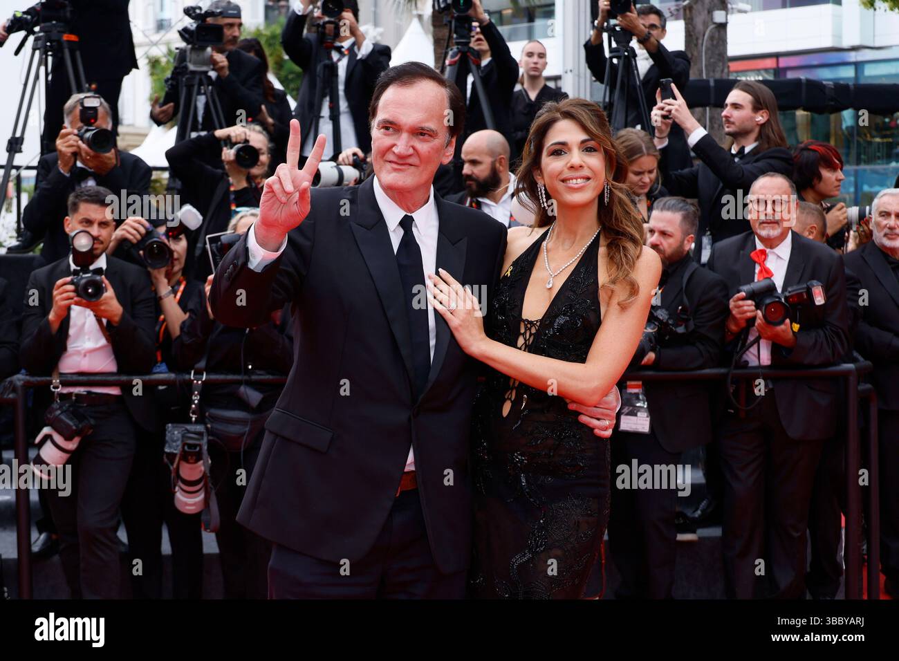 Quentin Tarantino, left, and Daniella Pick pose for photographers upon ...