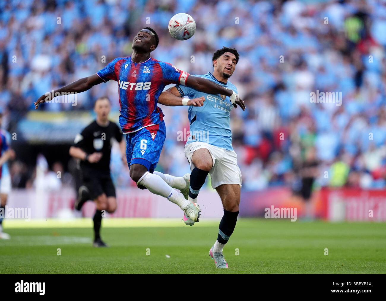 Crystal Palace's Marc Guehi (left) and Manchester City's Omar Marmoush ...
