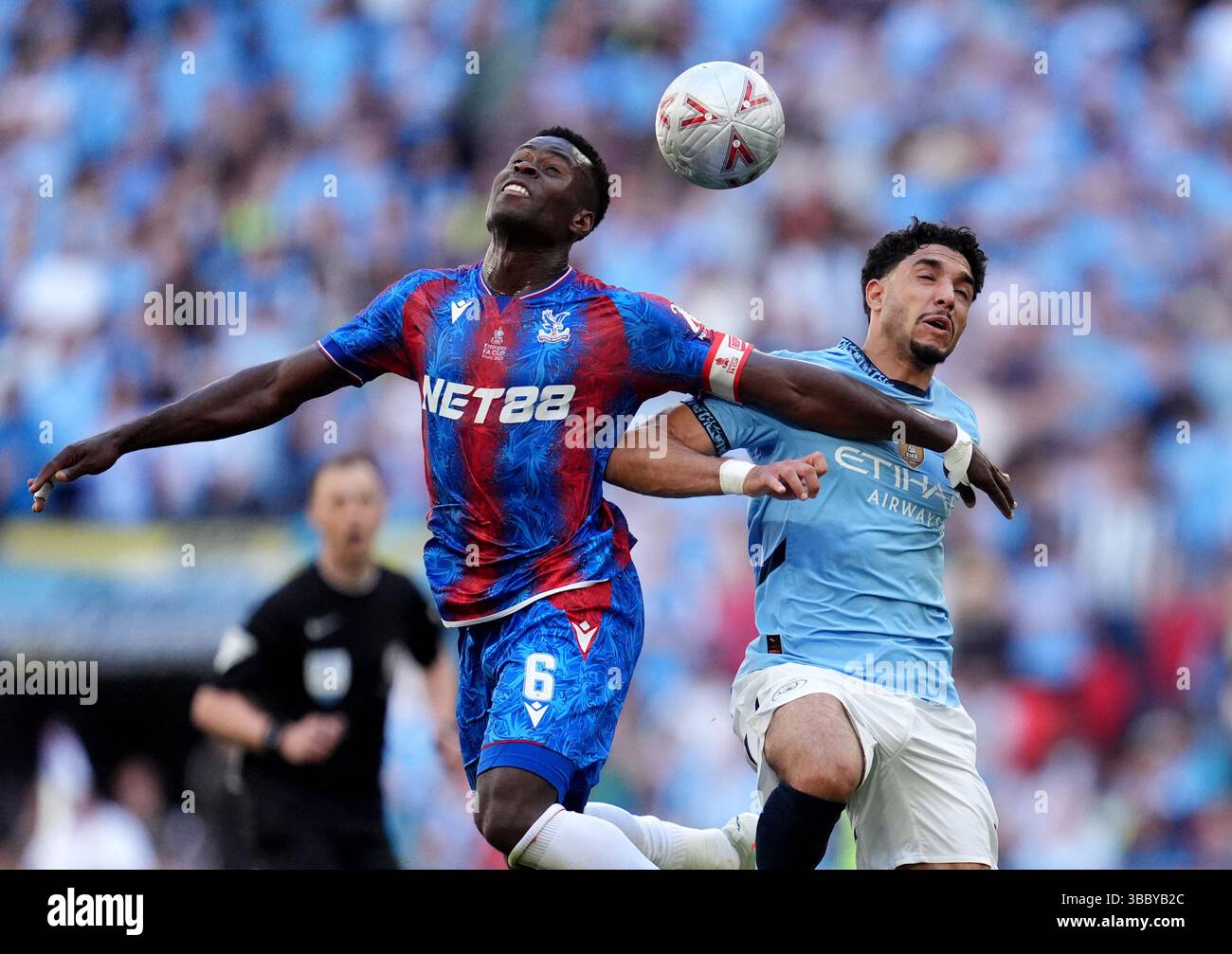 Crystal Palace's Marc Guehi (left) and Manchester City's Omar Marmoush ...