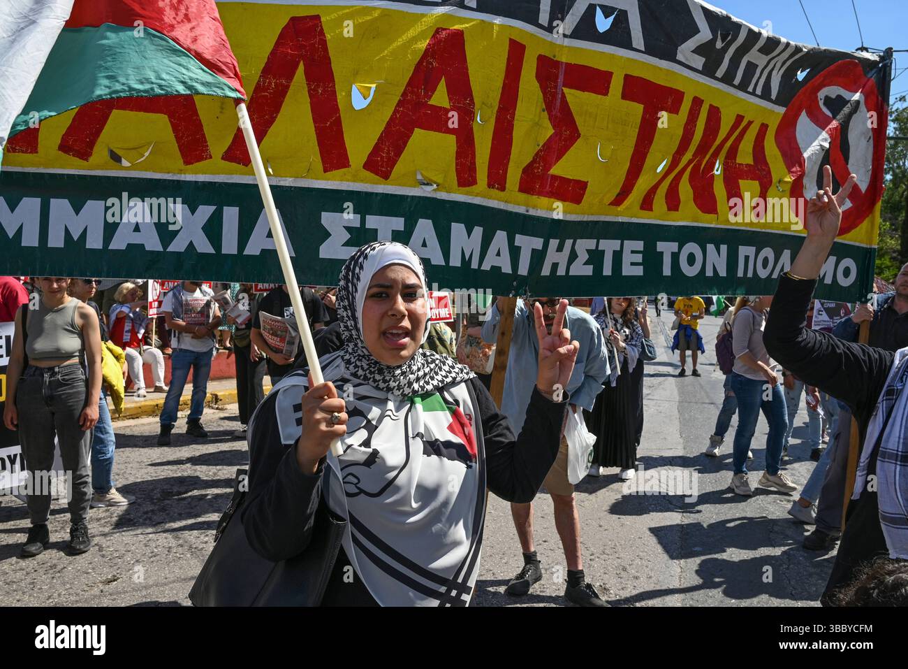 Commemoration of Nakba Day in Athens A woman wearing a Palestinian ...