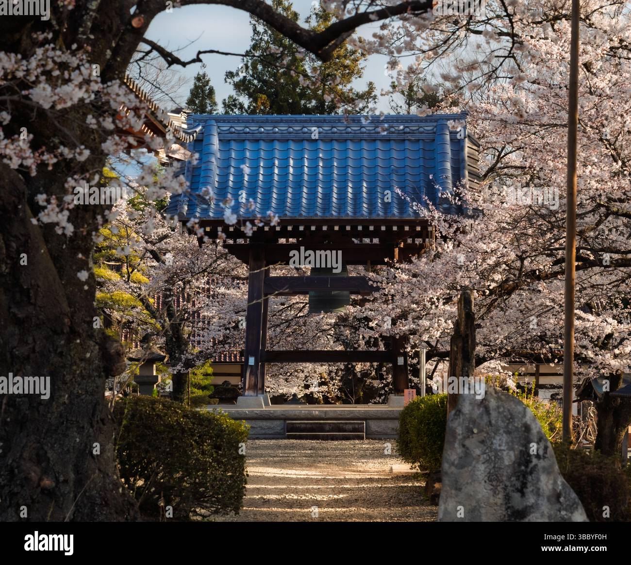 Traditional wooden bell tower at Jisso-ji Temple in the Hokuto region ...