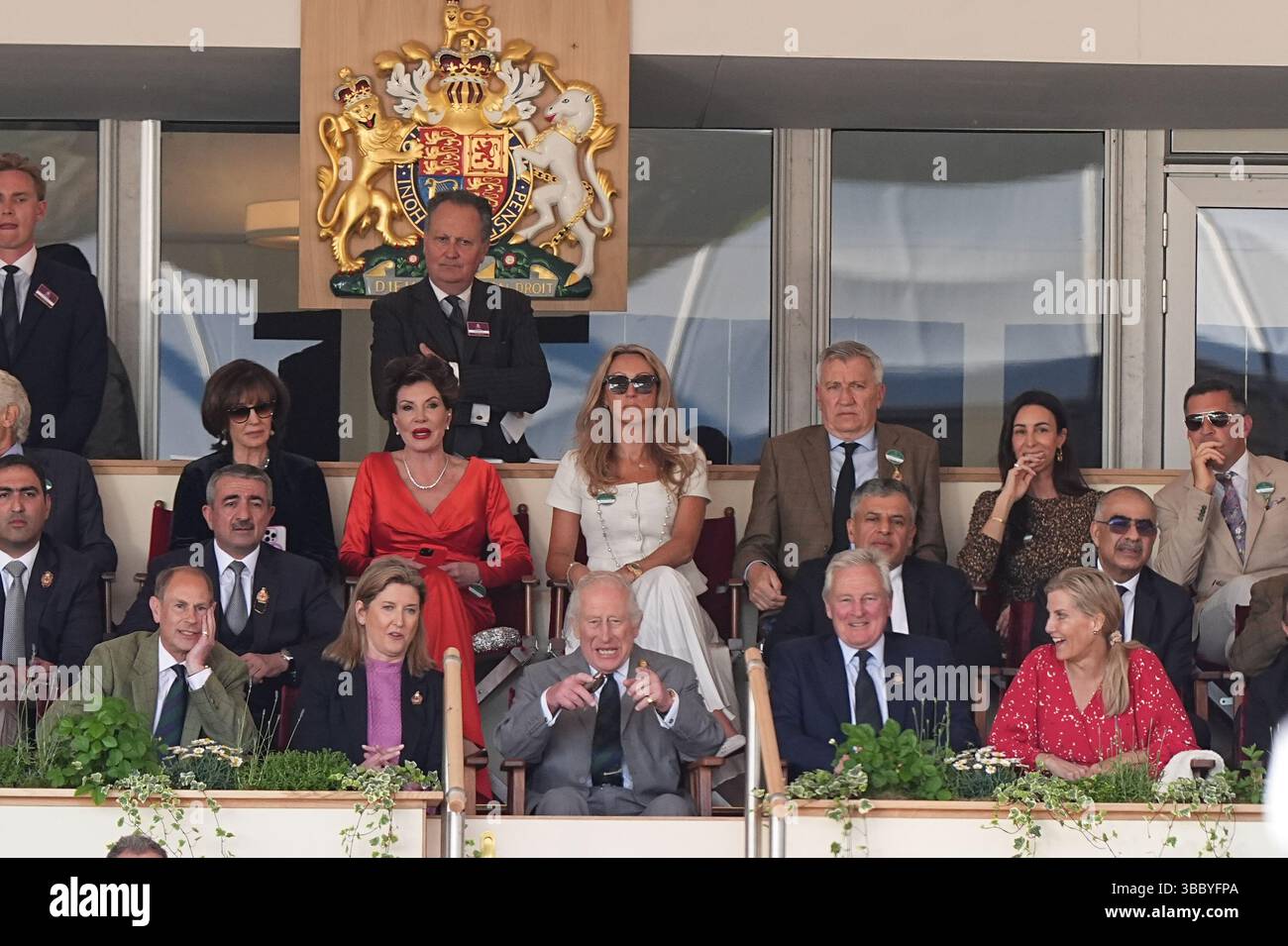 King Charles III (front centre) watching an event as he attends the ...