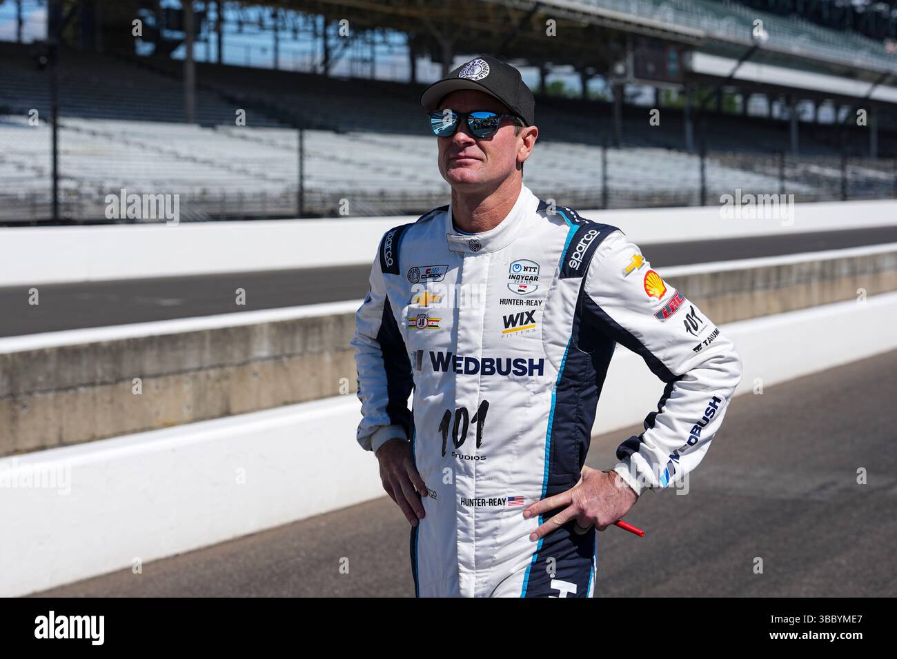 Ryan Hunter-Reay walks through the pit area before start of ...