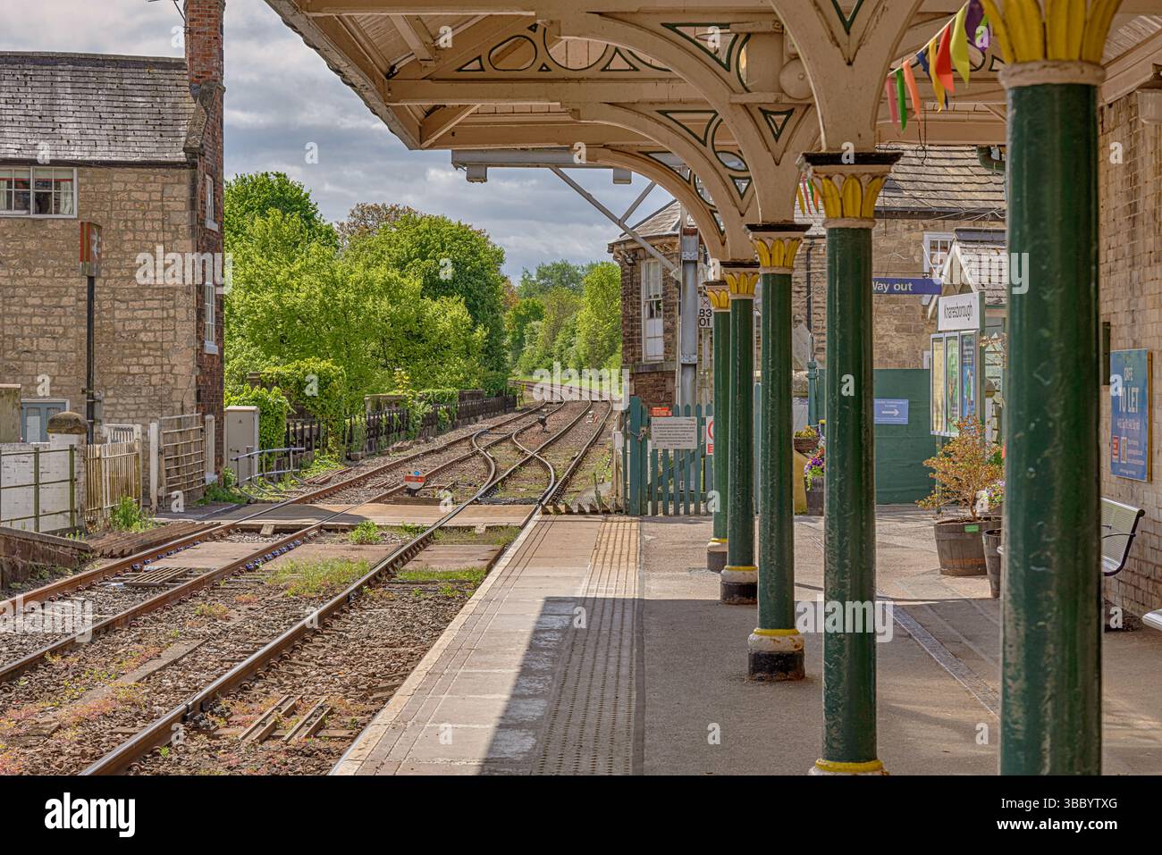 A historic railway station platform with a canopy and columns. Railway ...