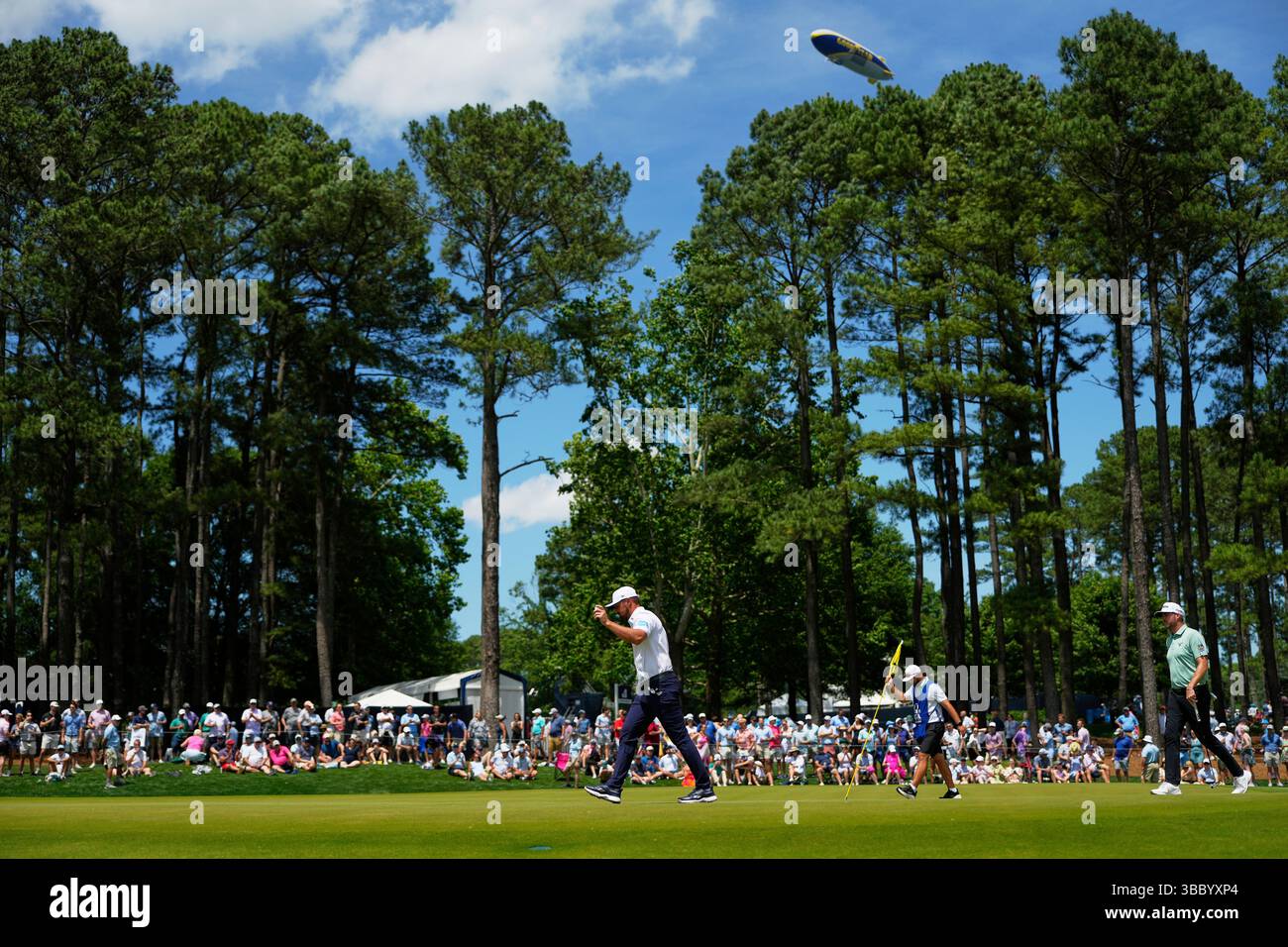 Bryson DeChambeau waves after making a putt on the sixth hole during ...
