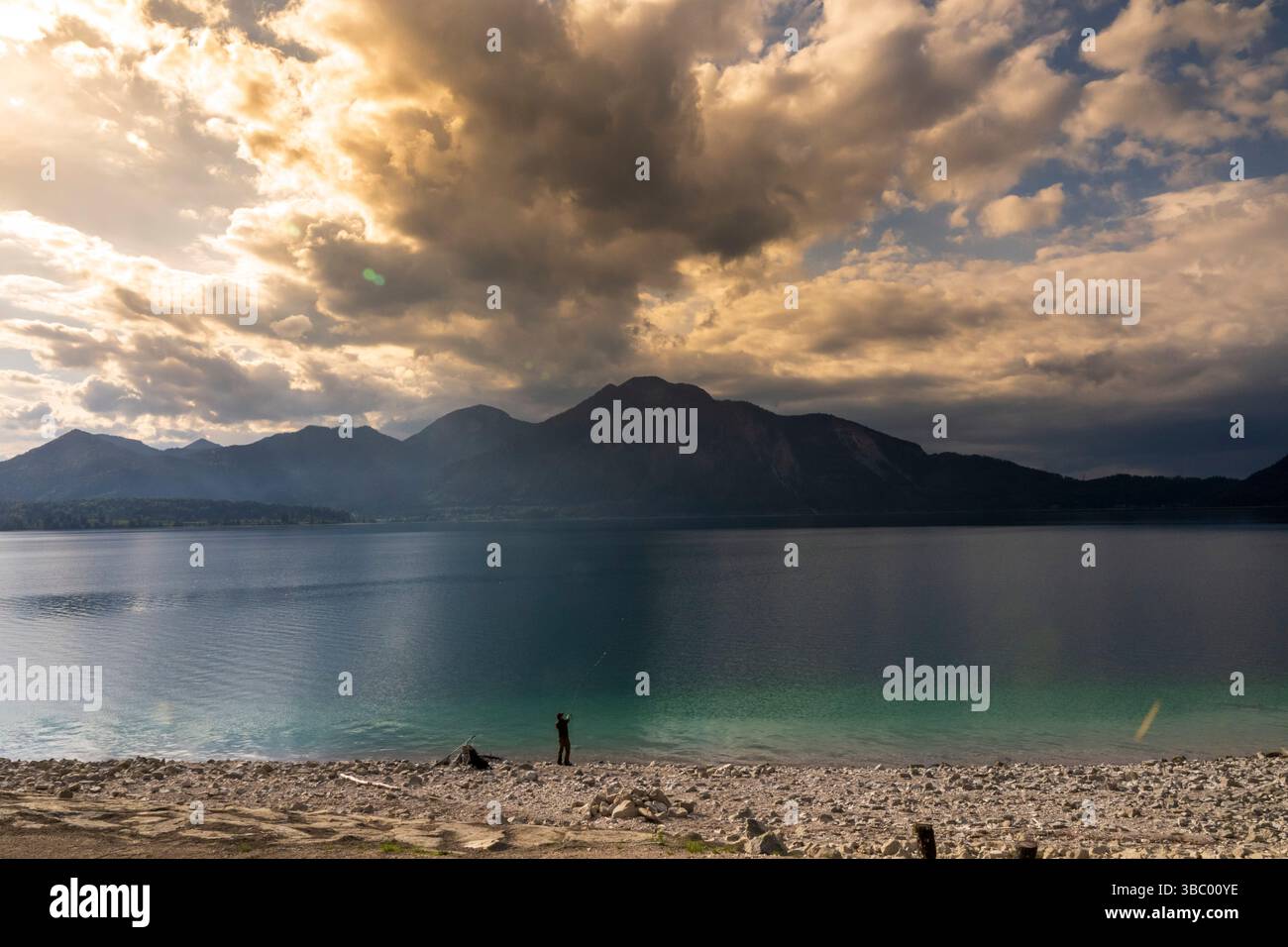 Walchensee, Germany. 17th May, 2025. A man is fishing in the late ...