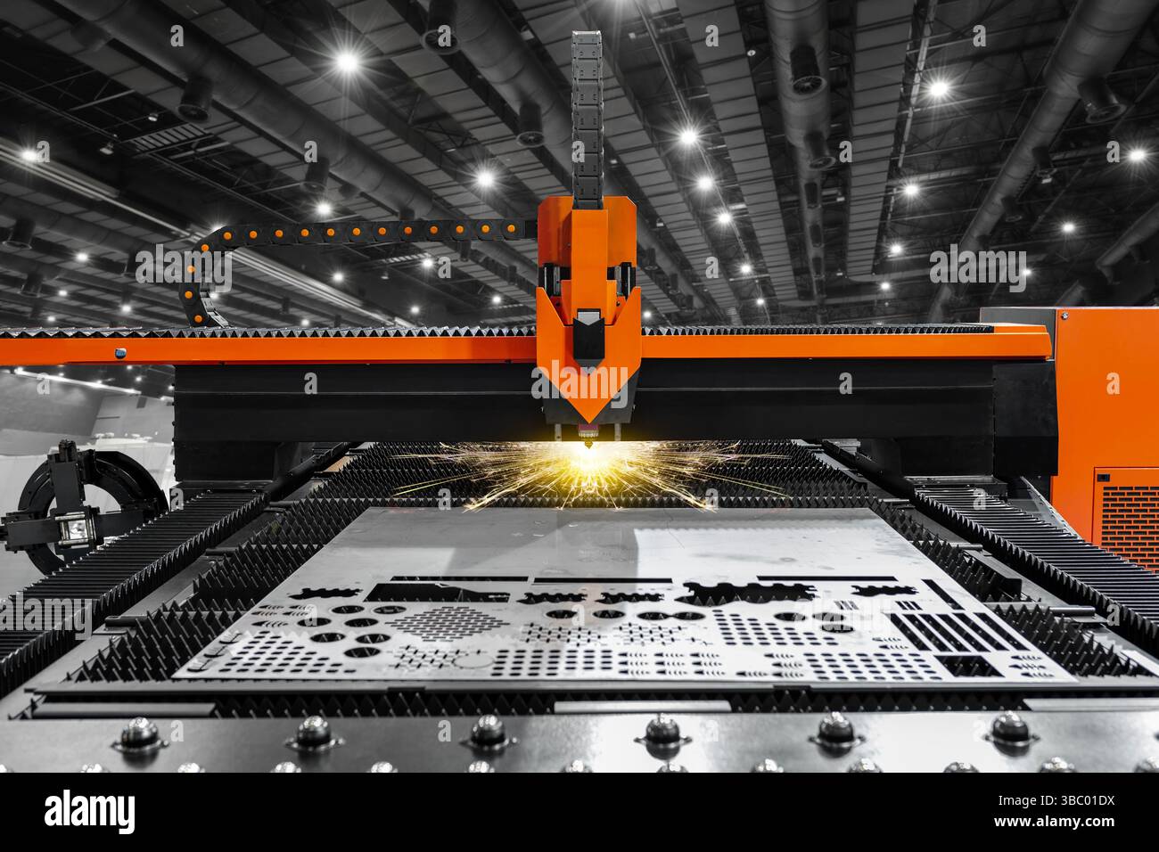 Cutting of sheet metal process. Sparks fly from laser by automatic ...