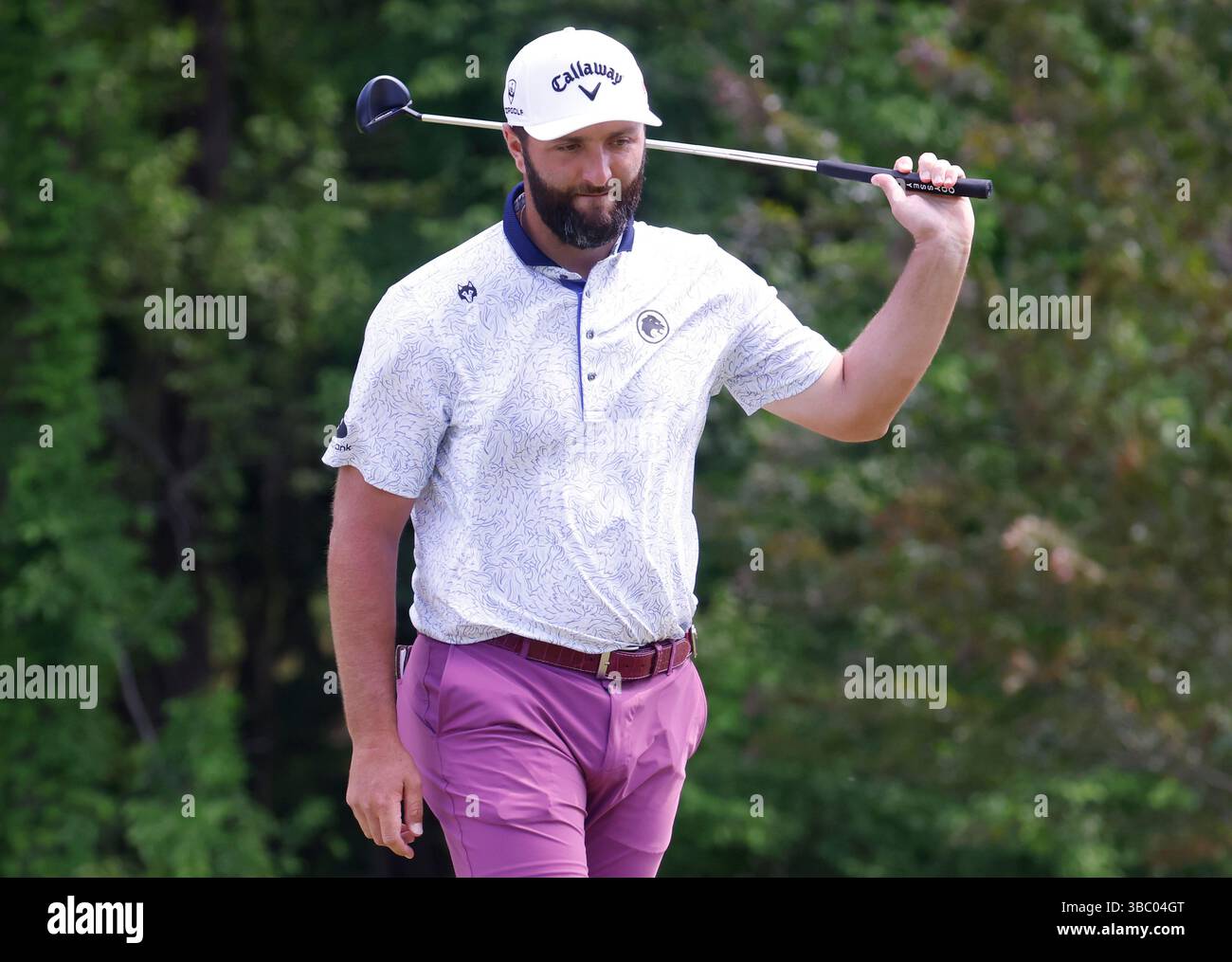 Jon Rahm of Spain reacts after putting on the 12th hole during the ...