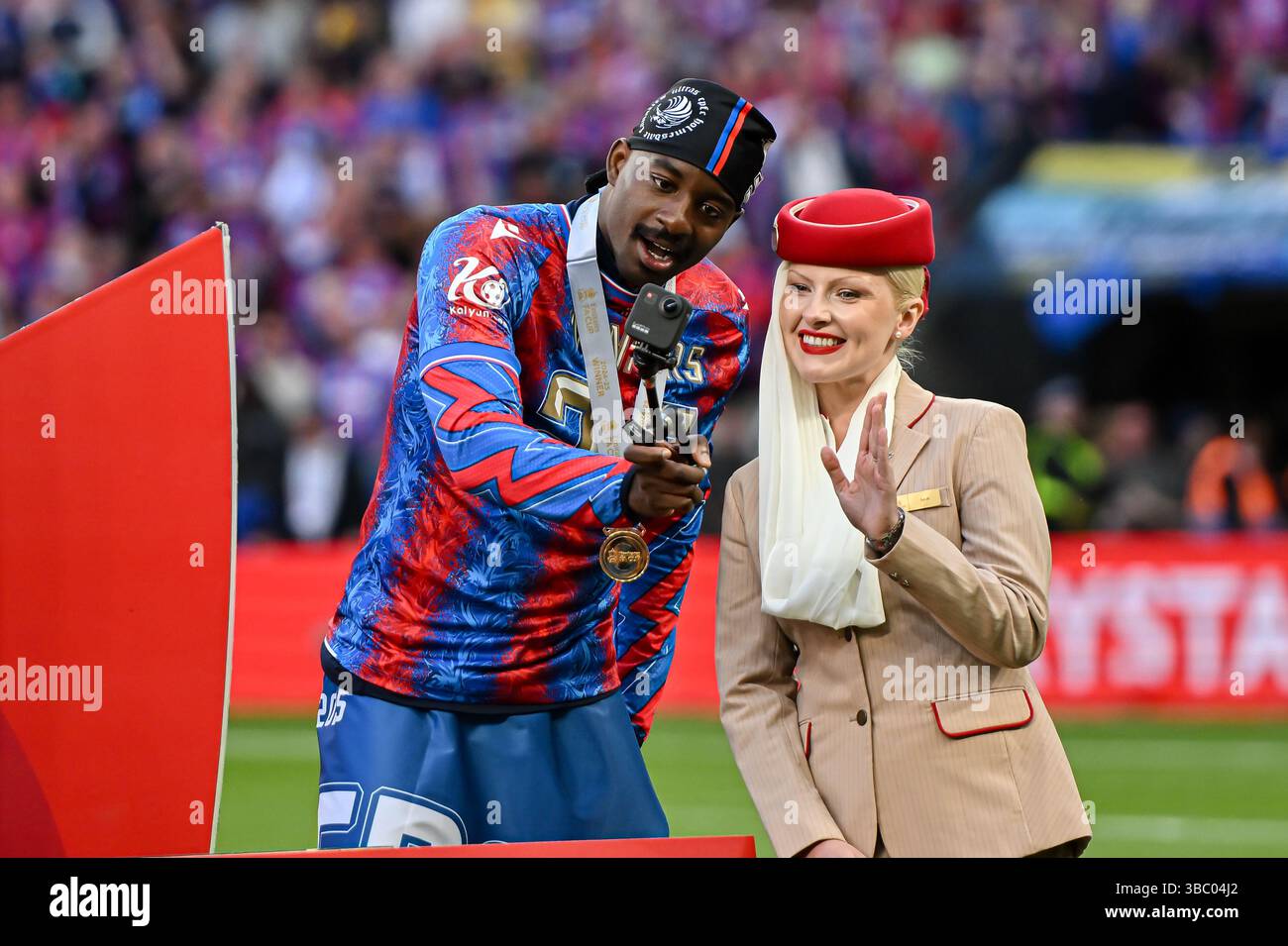 Jean Philippe Mateta (14 Crystal Palace) with one of the female ...
