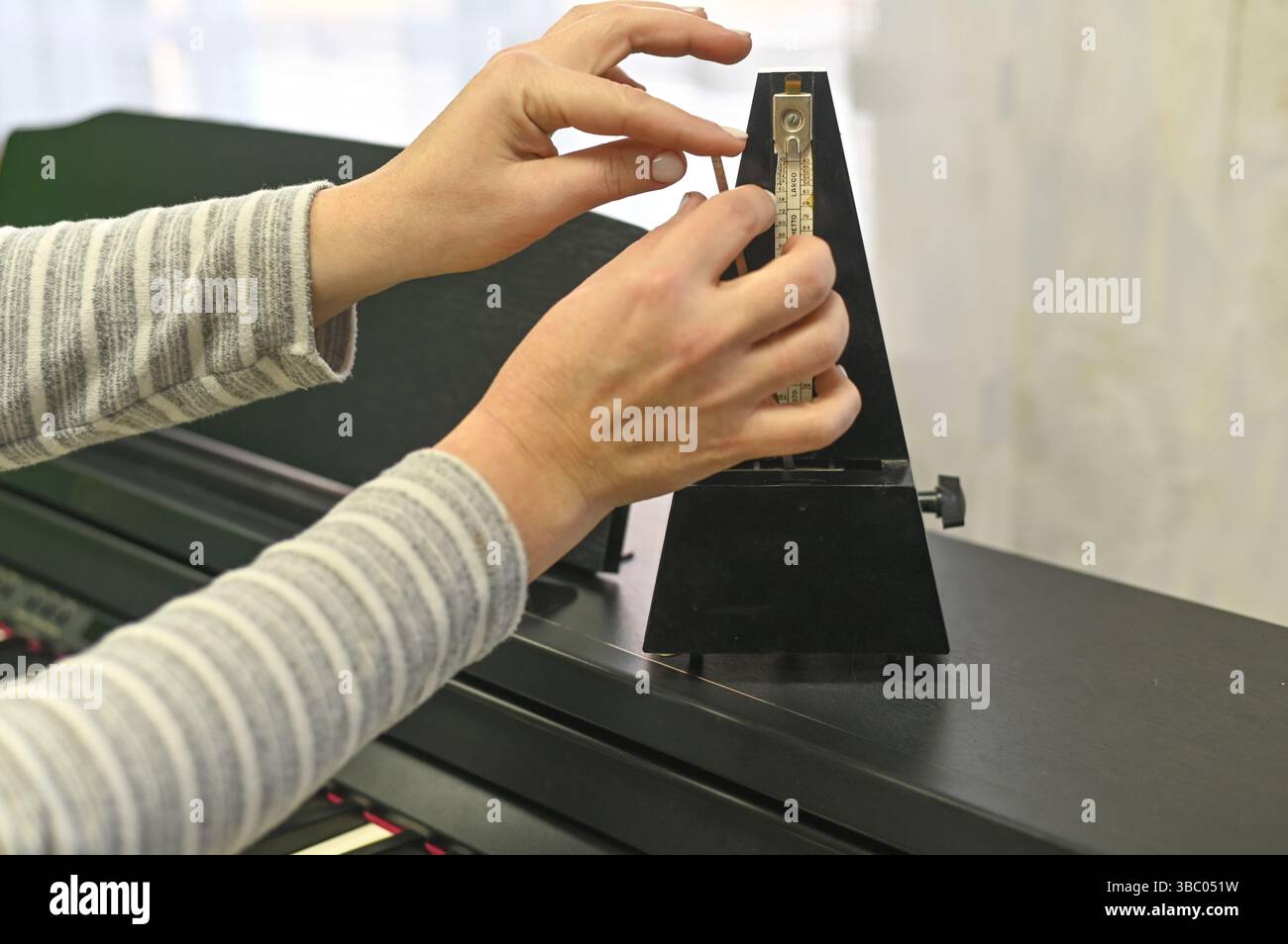 Adjusting metronome hi-res stock photography and images - Alamy