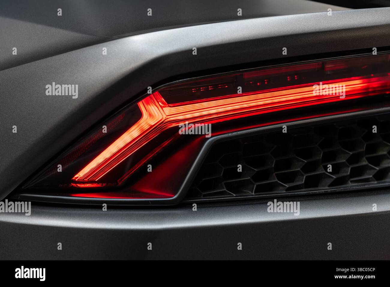 Red rear lights of modern sports car Stock Photo - Alamy