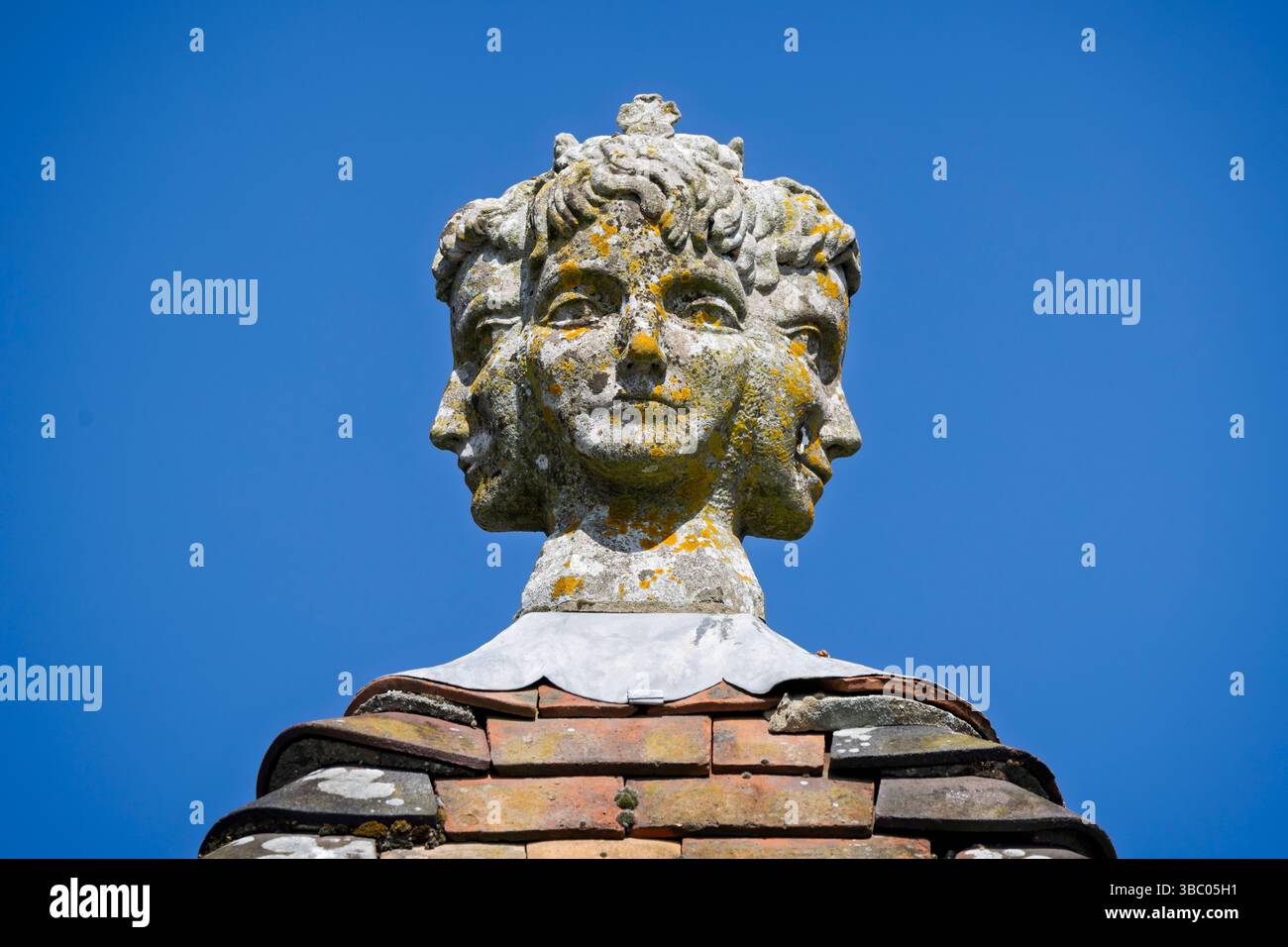 Medieval Stone heads, representing the Four seasons on top of roof at ...