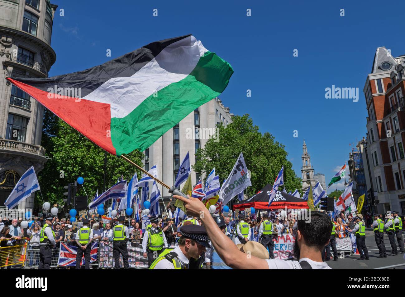 London, UK. 17th May, 2025. Pro Palestinian supporters carrying ...