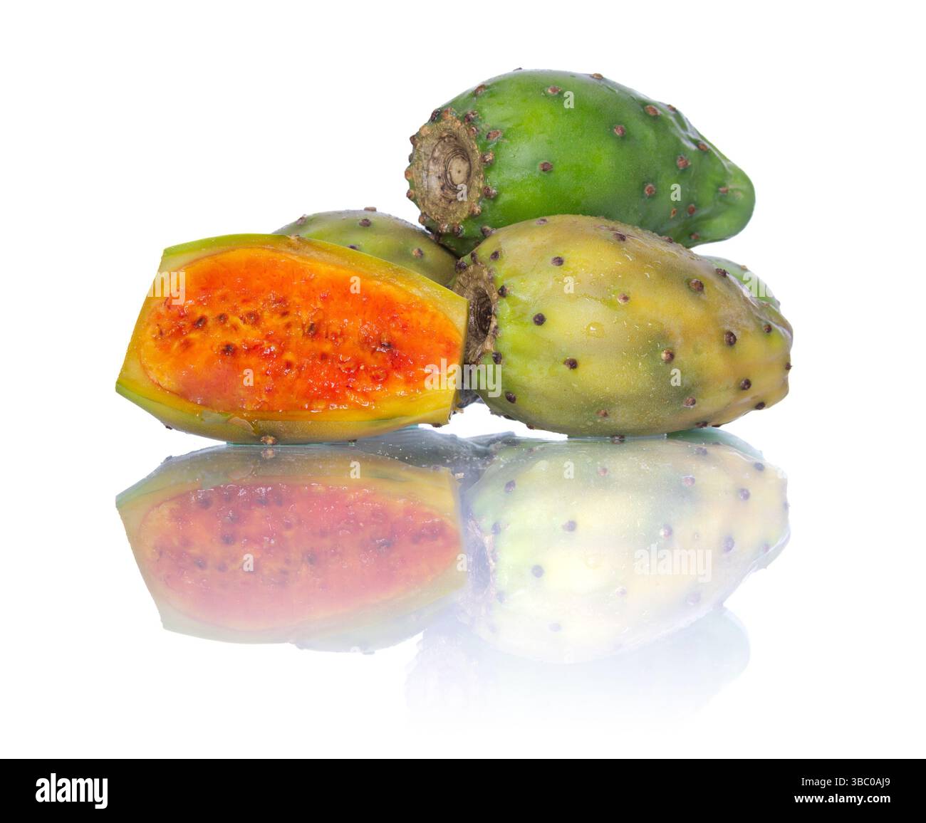 Fresh and ripe prickly pears with one cut open showing the pulp ...