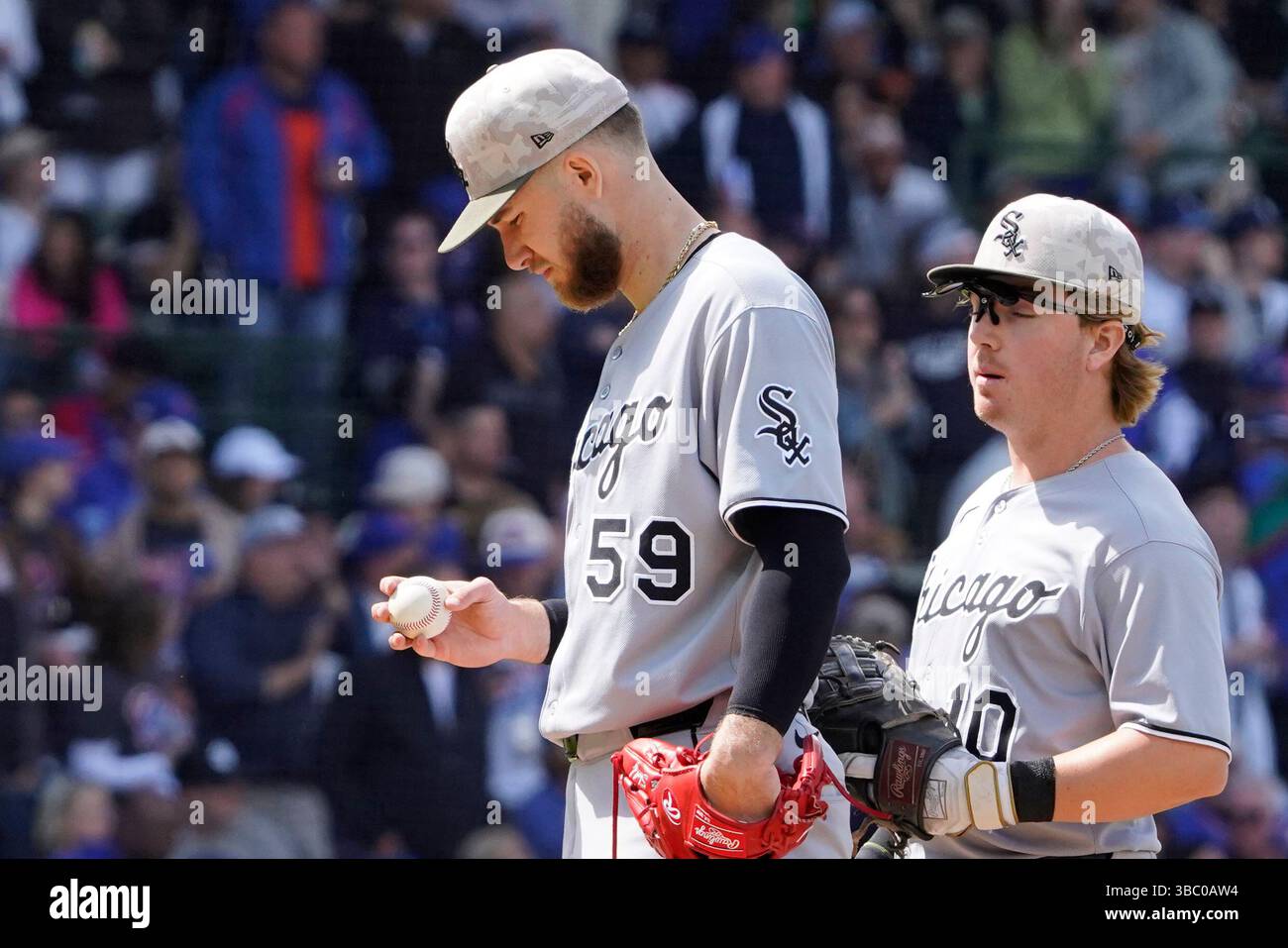 Chicago White Sox pitcher Sean Burke (59) looks at the ball as he ...