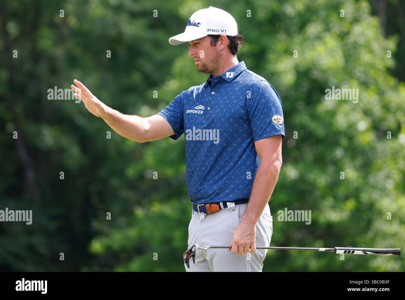 Davis Riley lines up a putt on the 12th hole during the third round of ...