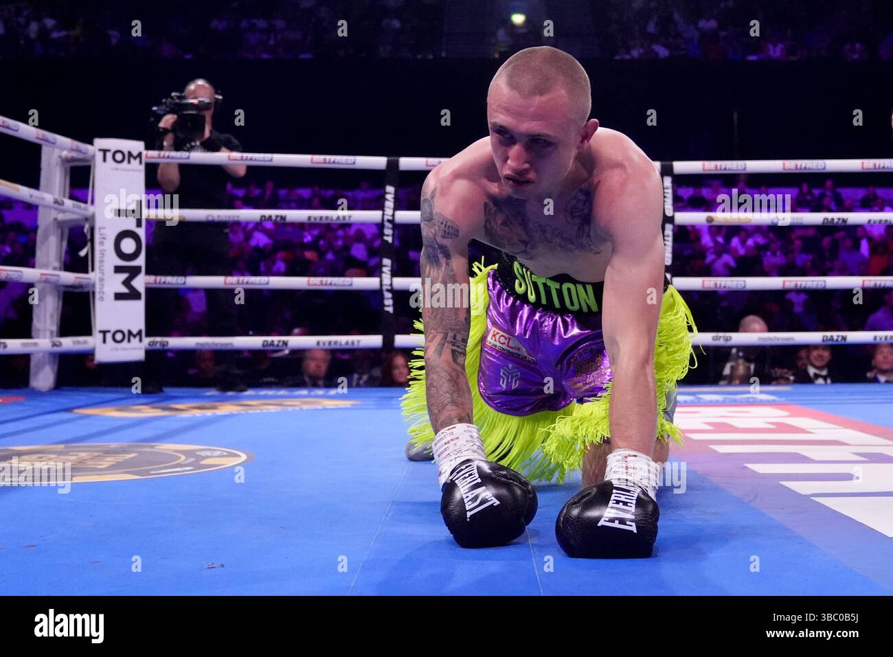 Aaron Sutton is knocked down by George Liddard before his team throw in the towel during their ...