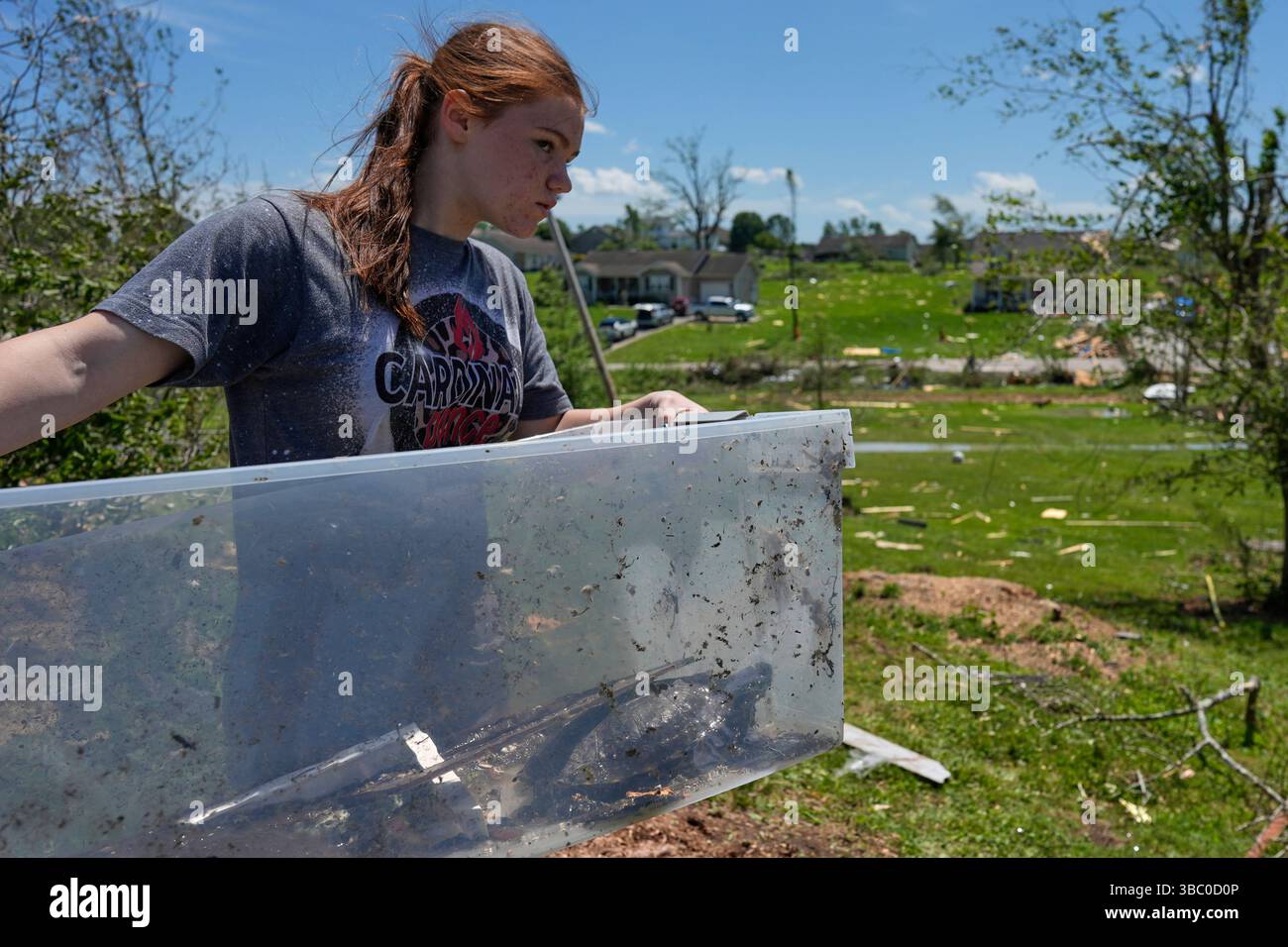 Grier Allen carries Lynn White's pet turtle in a plastic bin from what ...