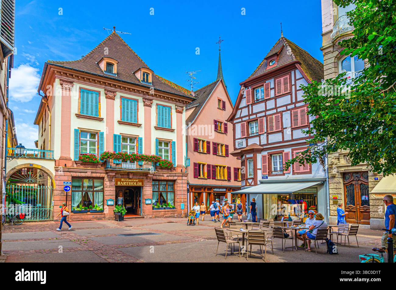 Colmar, France, July 11, 2024: people walking small pedestrian square ...