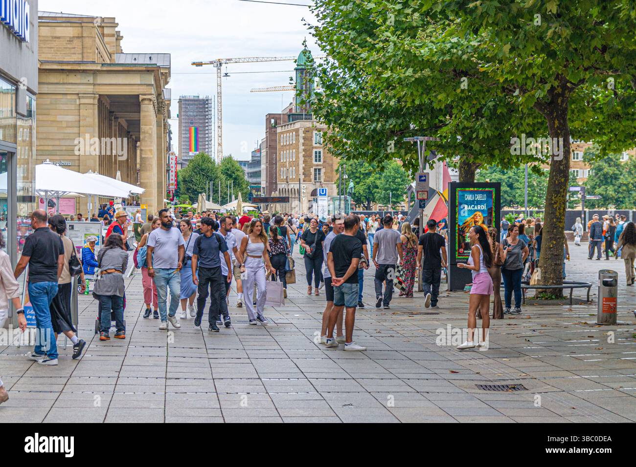 Stuttgart, Germany, July 12, 2024: crowd of people tourists walking ...