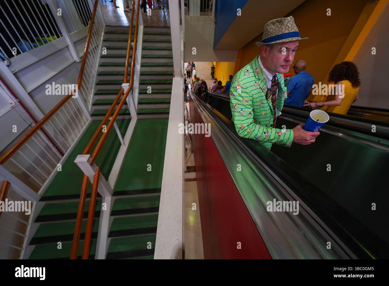 Justin Neel, of Kansas City, Mo., wears a horse racing inspired suit ...