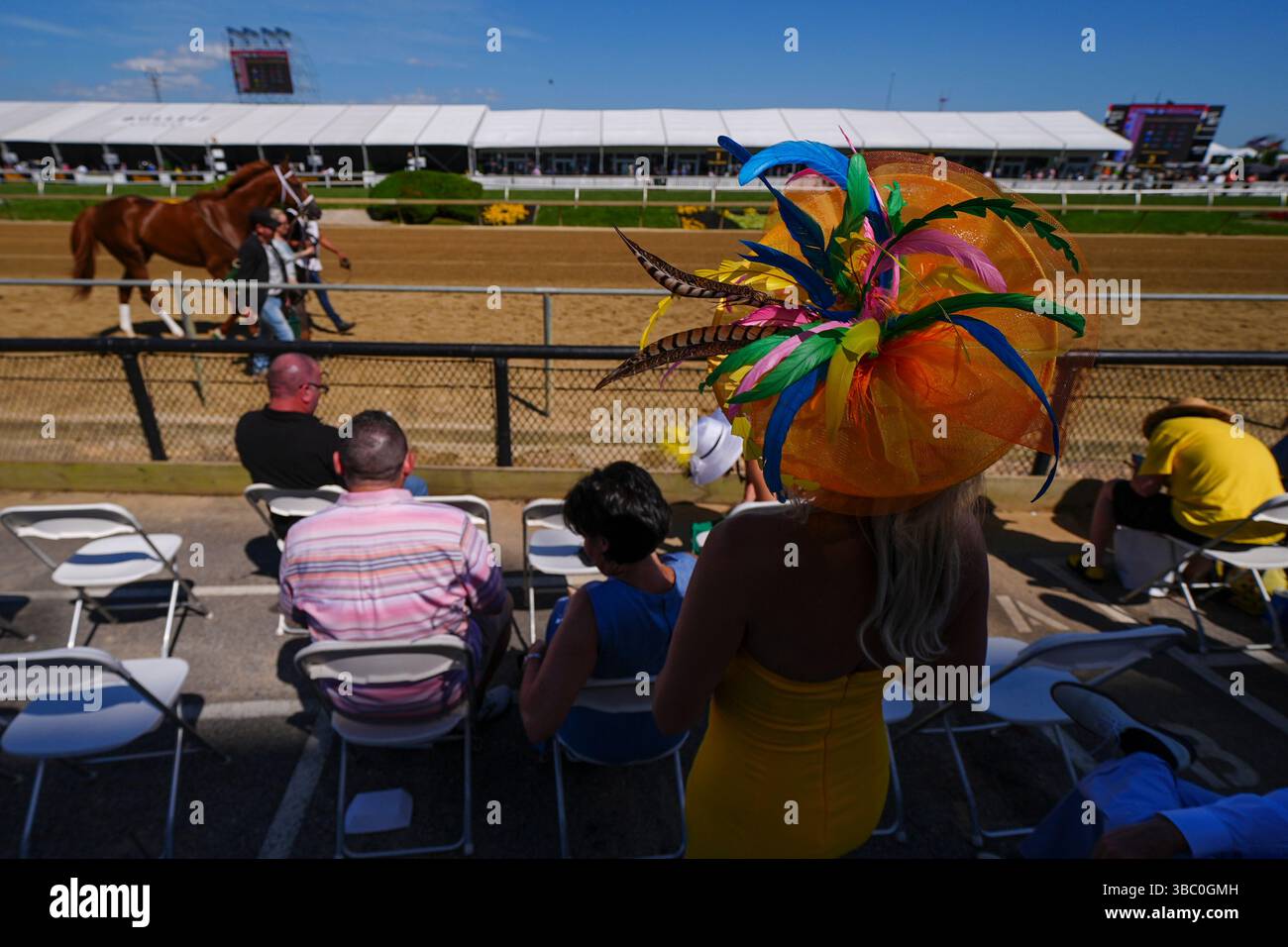 Brandy Lee, of Delray Beach, Fla., wears a decorative hat as a horse ...