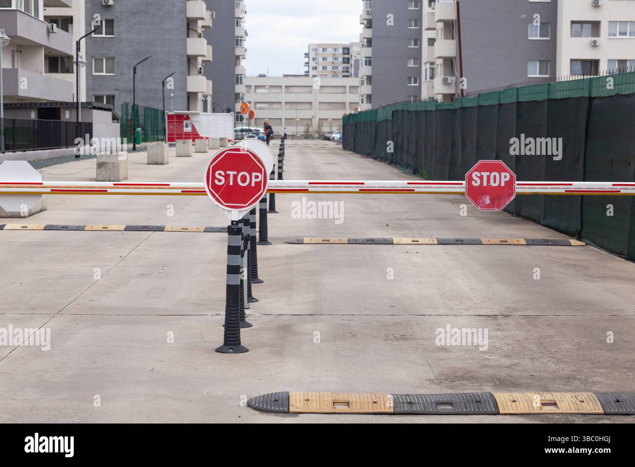 Closed private road access with stop signs and Stock Photo - Alamy