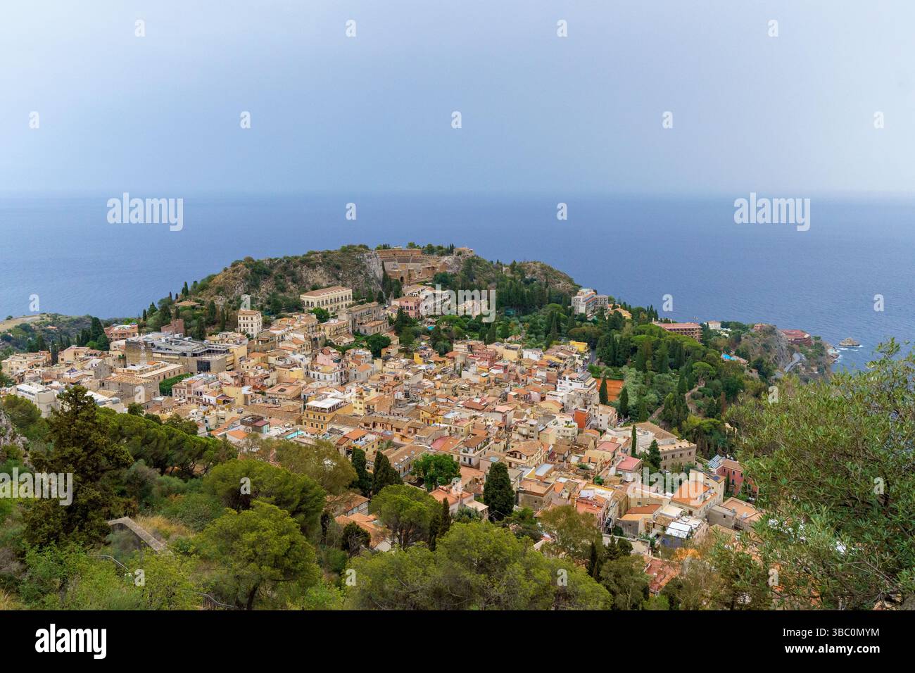 View from above Taormina with the medieval city center, the ancient ...
