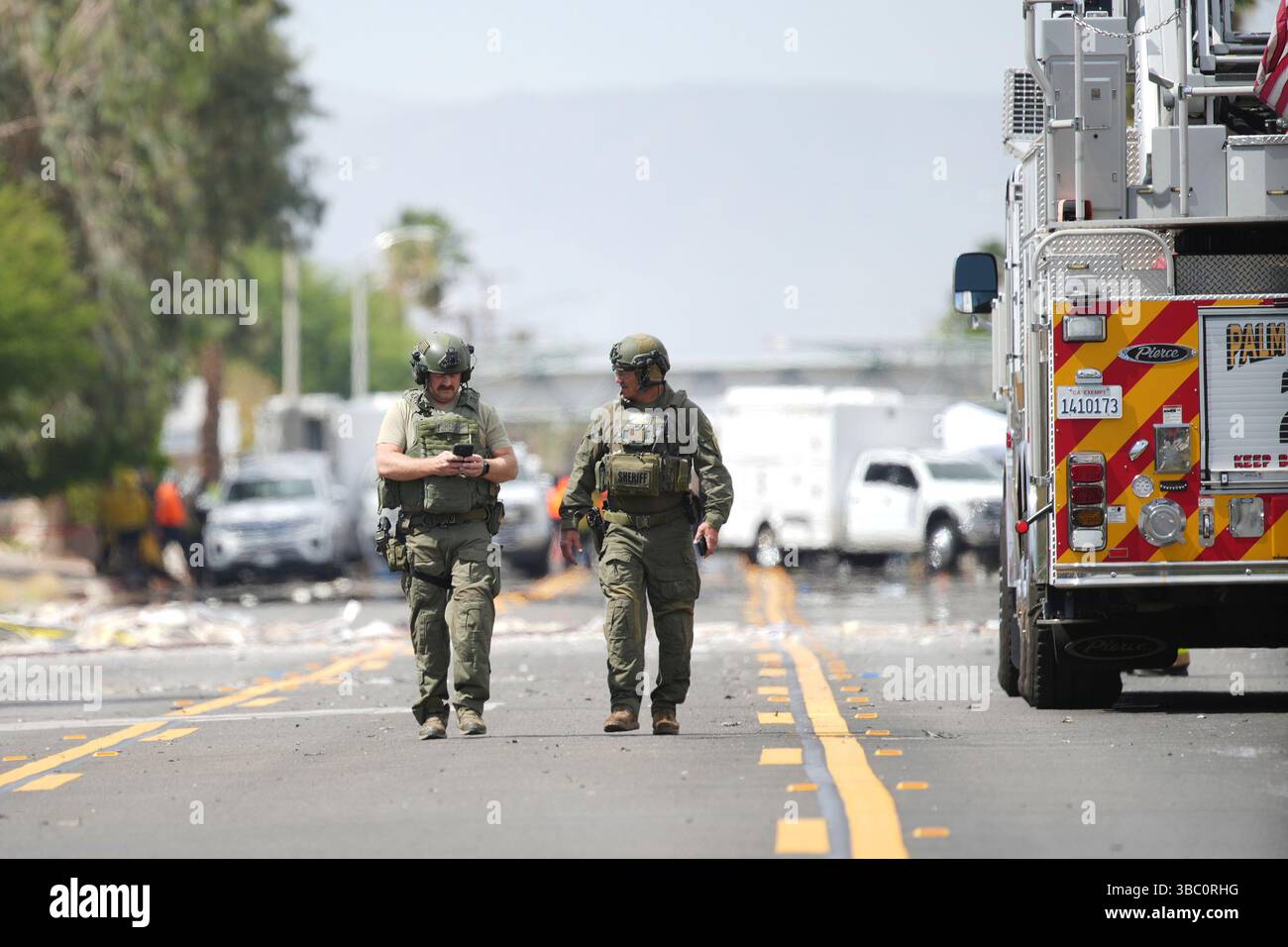 Sheriffs deputies walk near the scene of an explosion Saturday, May 17 ...